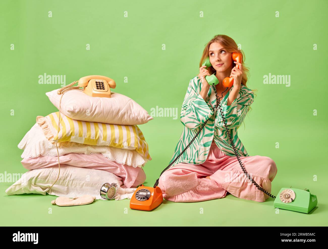 Wake up calls. Full length portrait of dissatisfied young woman in ...