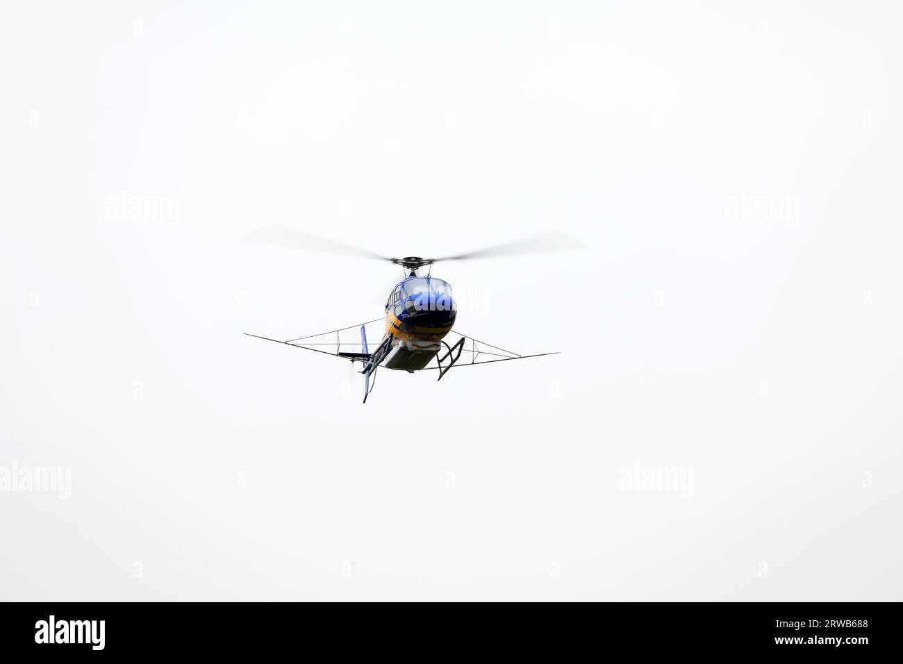 Agricultural helicopters fly in the sky Stock Photo - Alamy