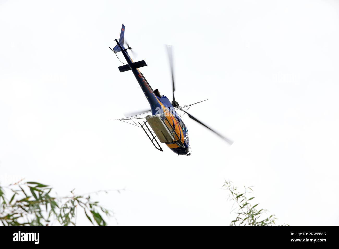 Agricultural helicopters fly in the sky Stock Photo - Alamy