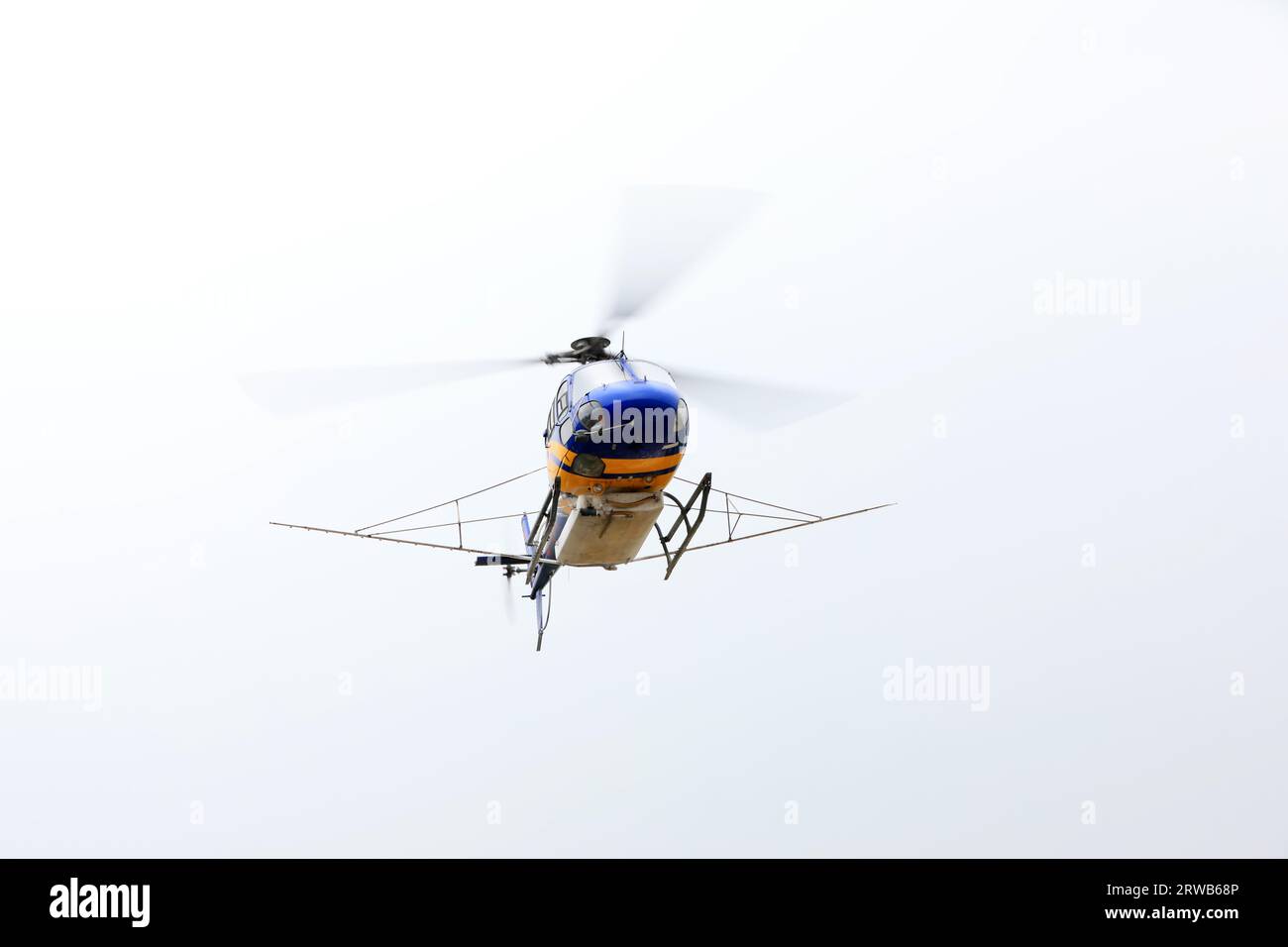 Agricultural helicopters fly in the sky Stock Photo - Alamy