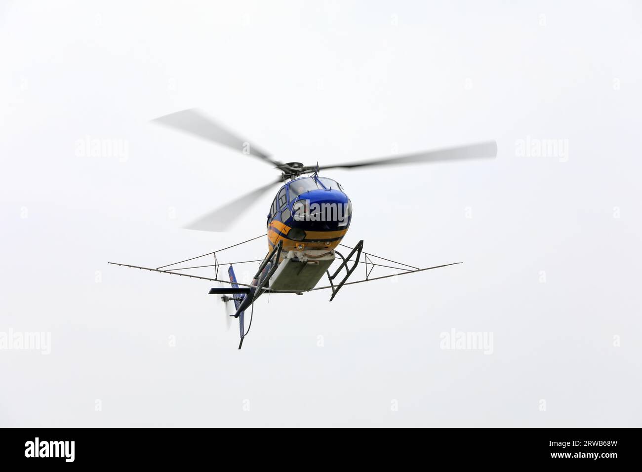 Agricultural helicopters fly in the sky Stock Photo - Alamy