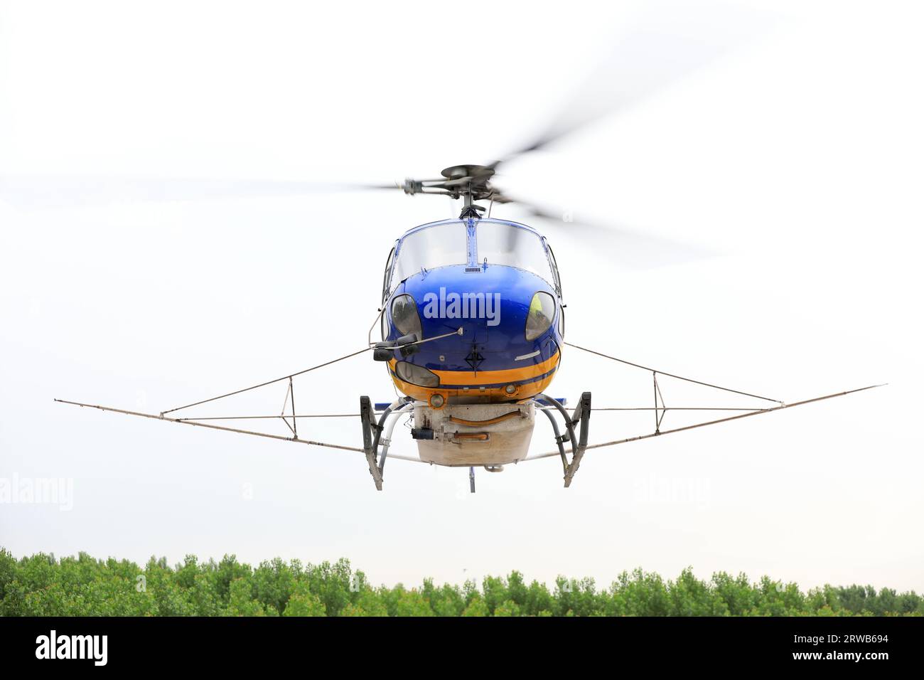 Agricultural helicopters fly in the sky Stock Photo - Alamy