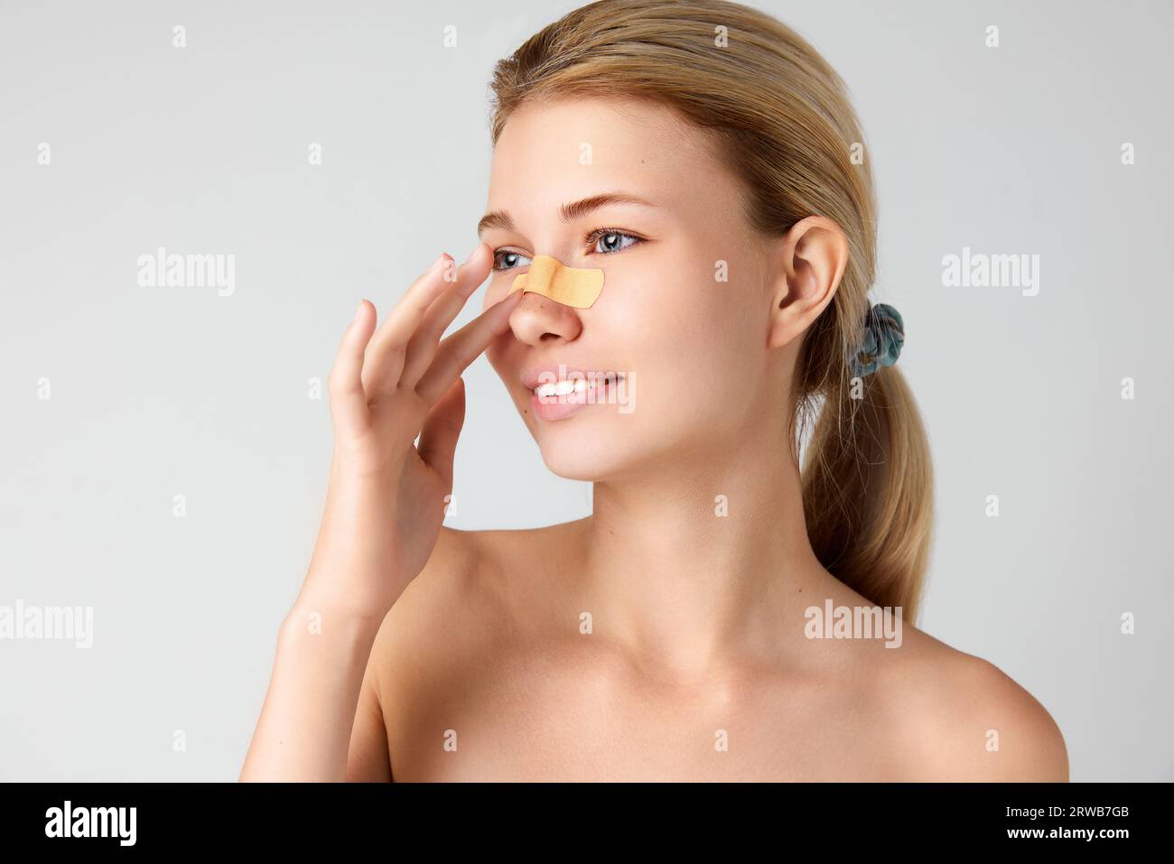 Beautiful young girl with plaster on nose after rhinoplasty surgery ...