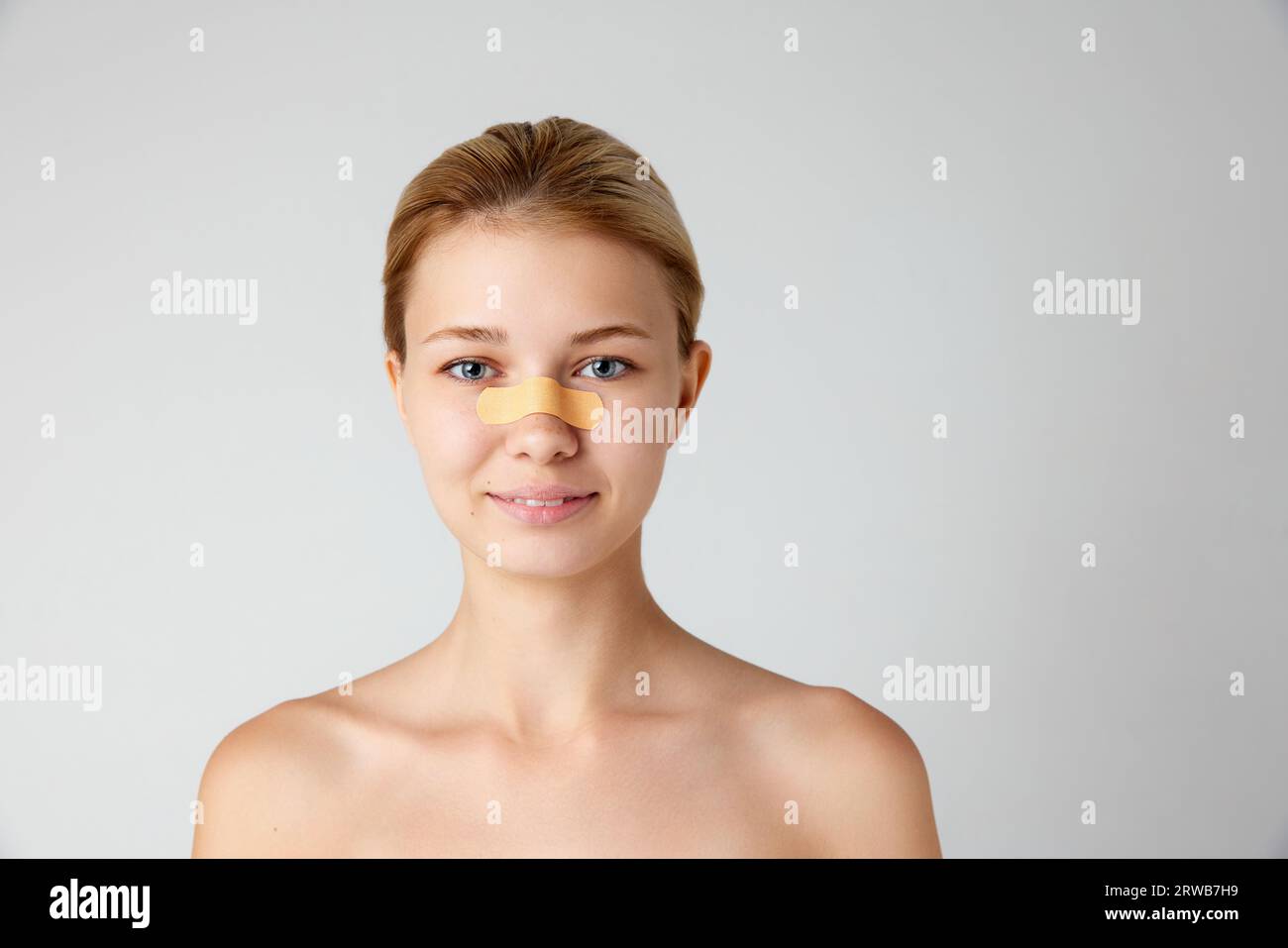 Beautiful young girl with plaster on nose after rhinoplasty surgery ...