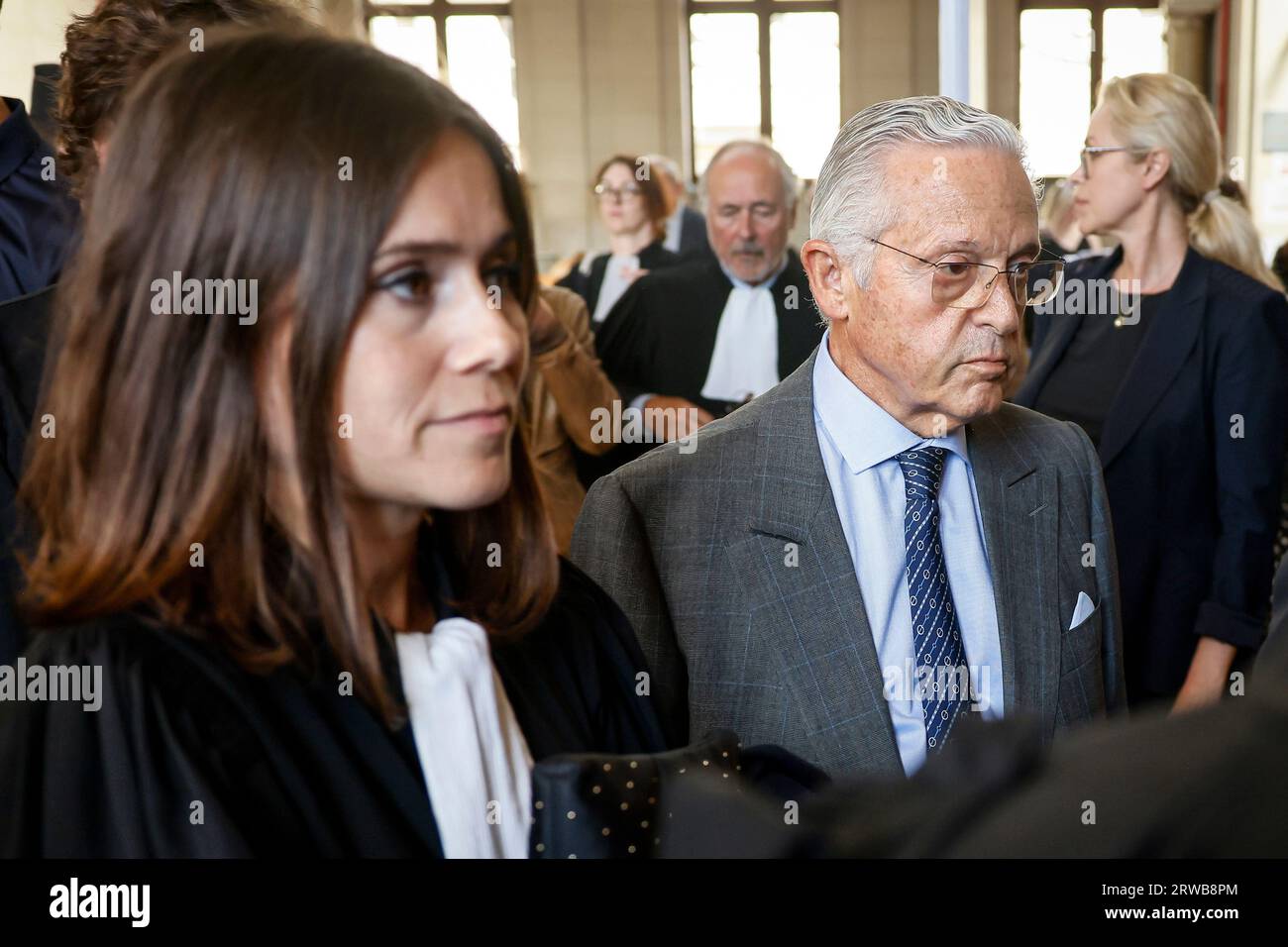 Art dealer Guy Wildenstein, right, arrives at Paris' courthouse with ...