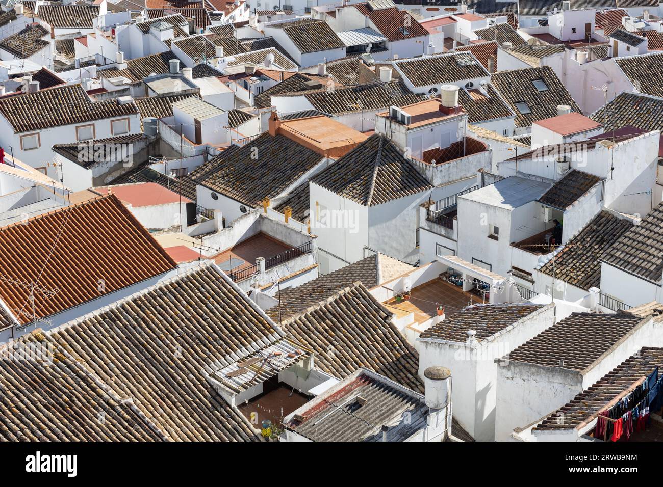 Aerial panoramic view of rooftops of white houses of Olvera town ...