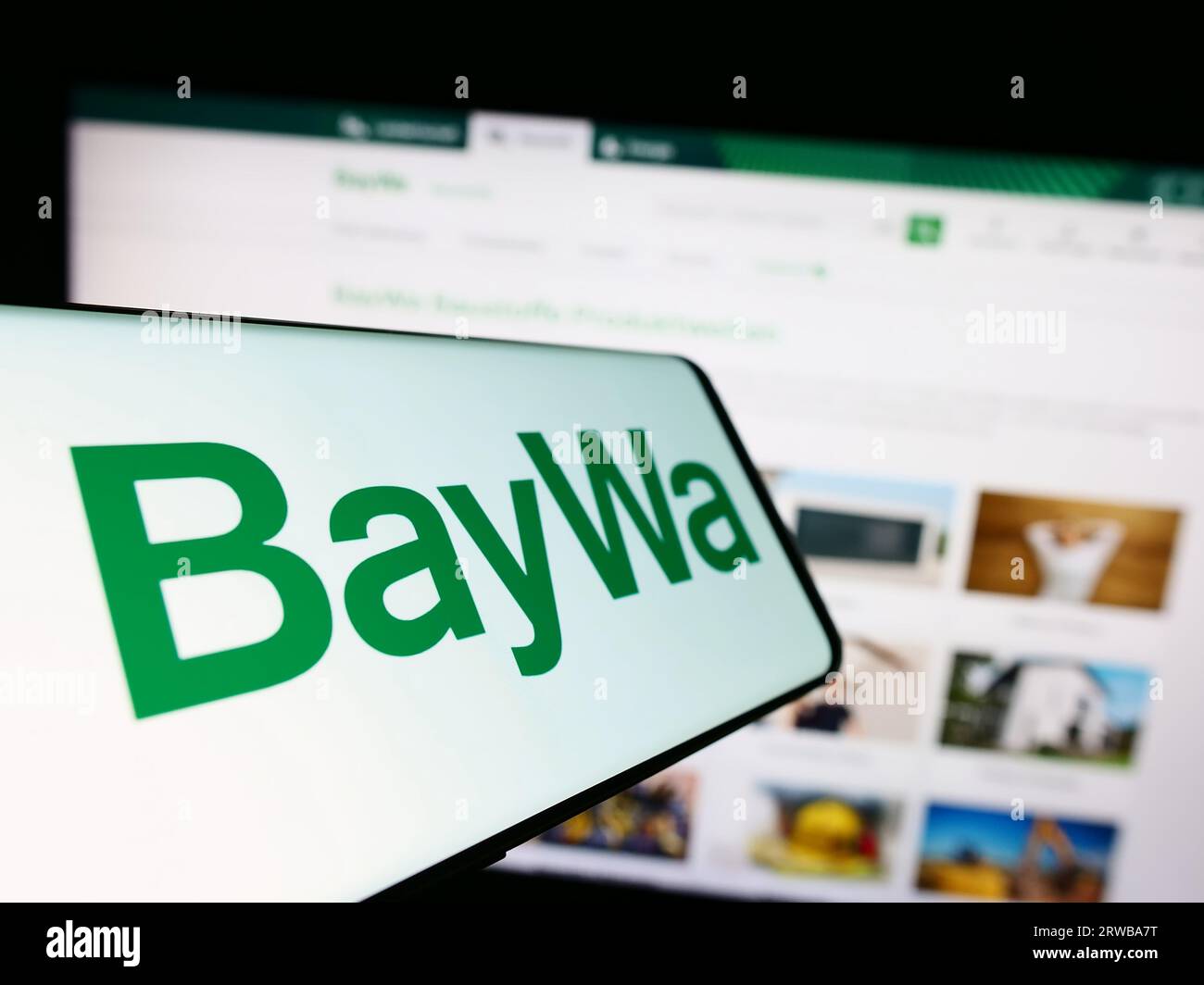 Smartphone with logo of German agribusiness company BayWa AG on screen ...