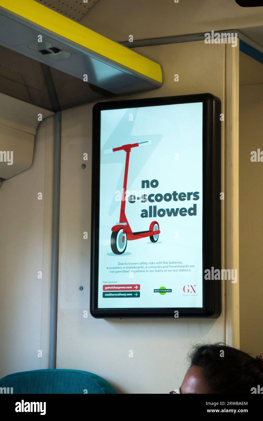 LCD screen sign board on a Southern train informing of e scooter and e ...
