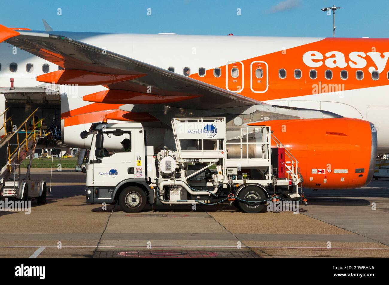 Refuelling Airbus Airbus A319-111 plane, number G-EZBF, operated by ...