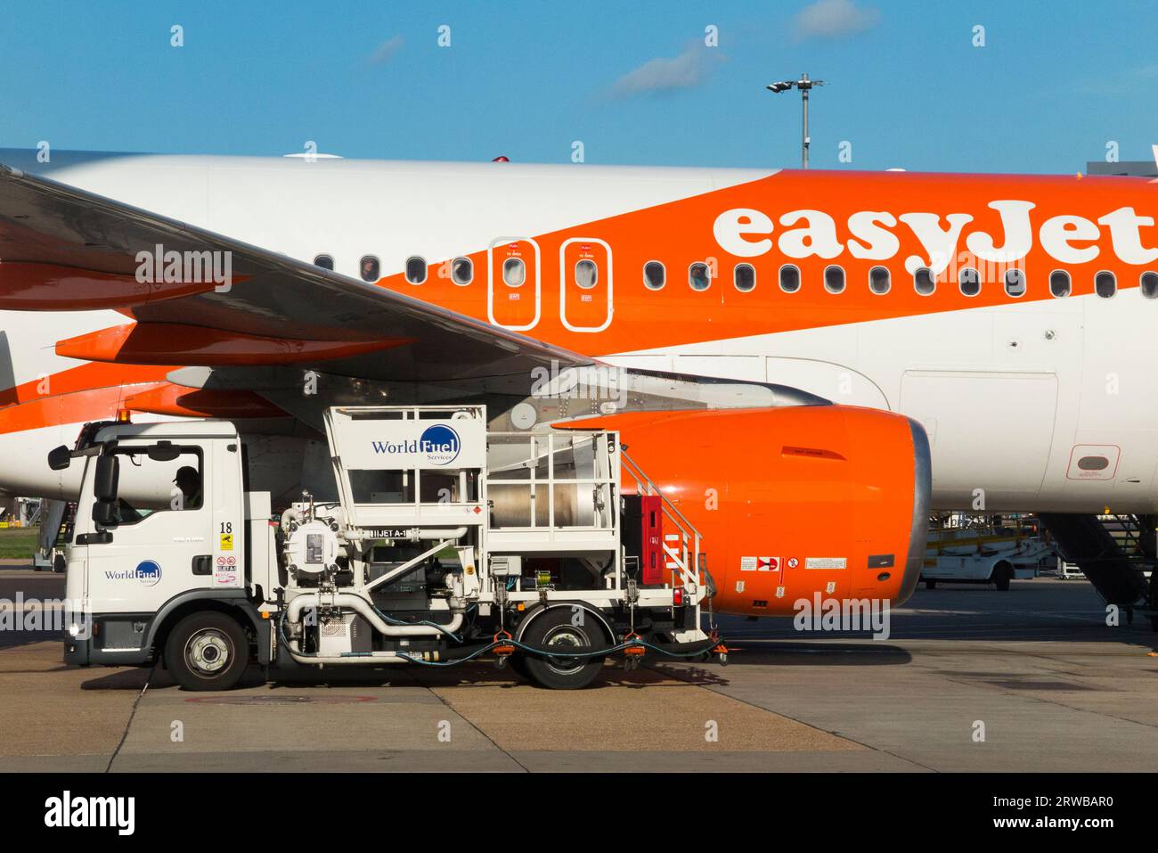 Refuelling Airbus Airbus A319-111 plane, number G-EZBF, operated by ...