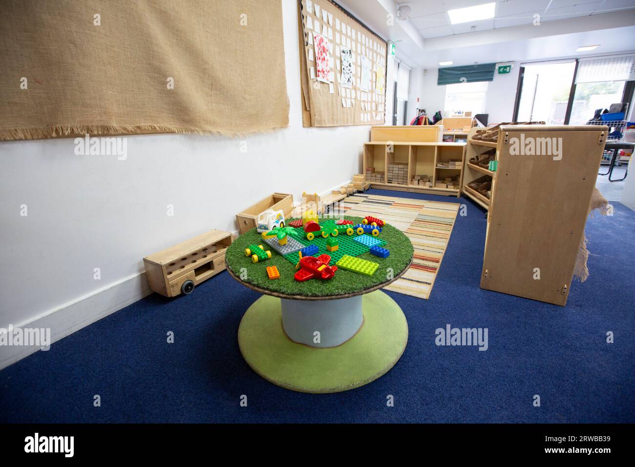 Nursery classroom scene for primary aged school children full of ...