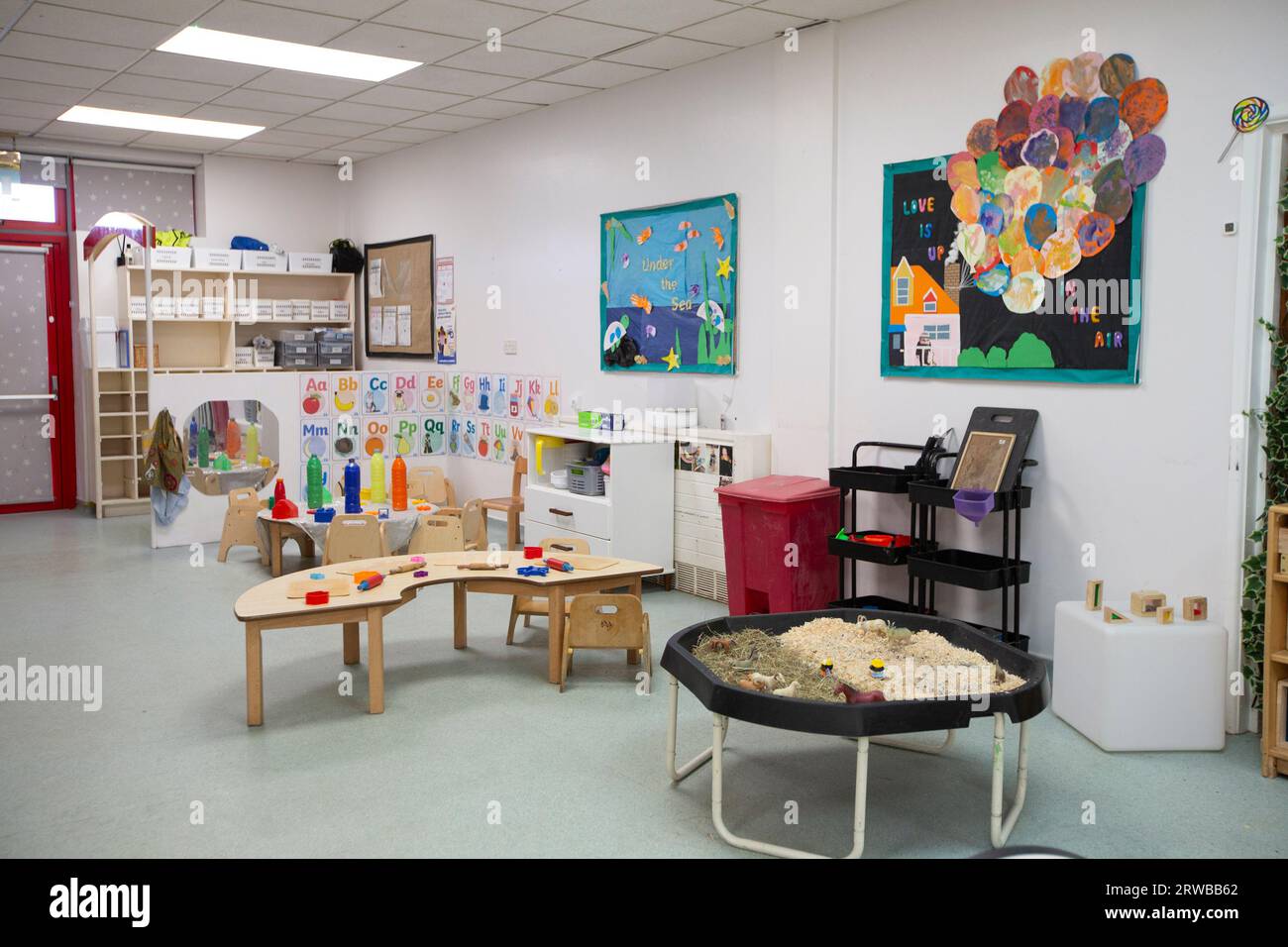 Nursery classroom scene for primary aged school children full of ...