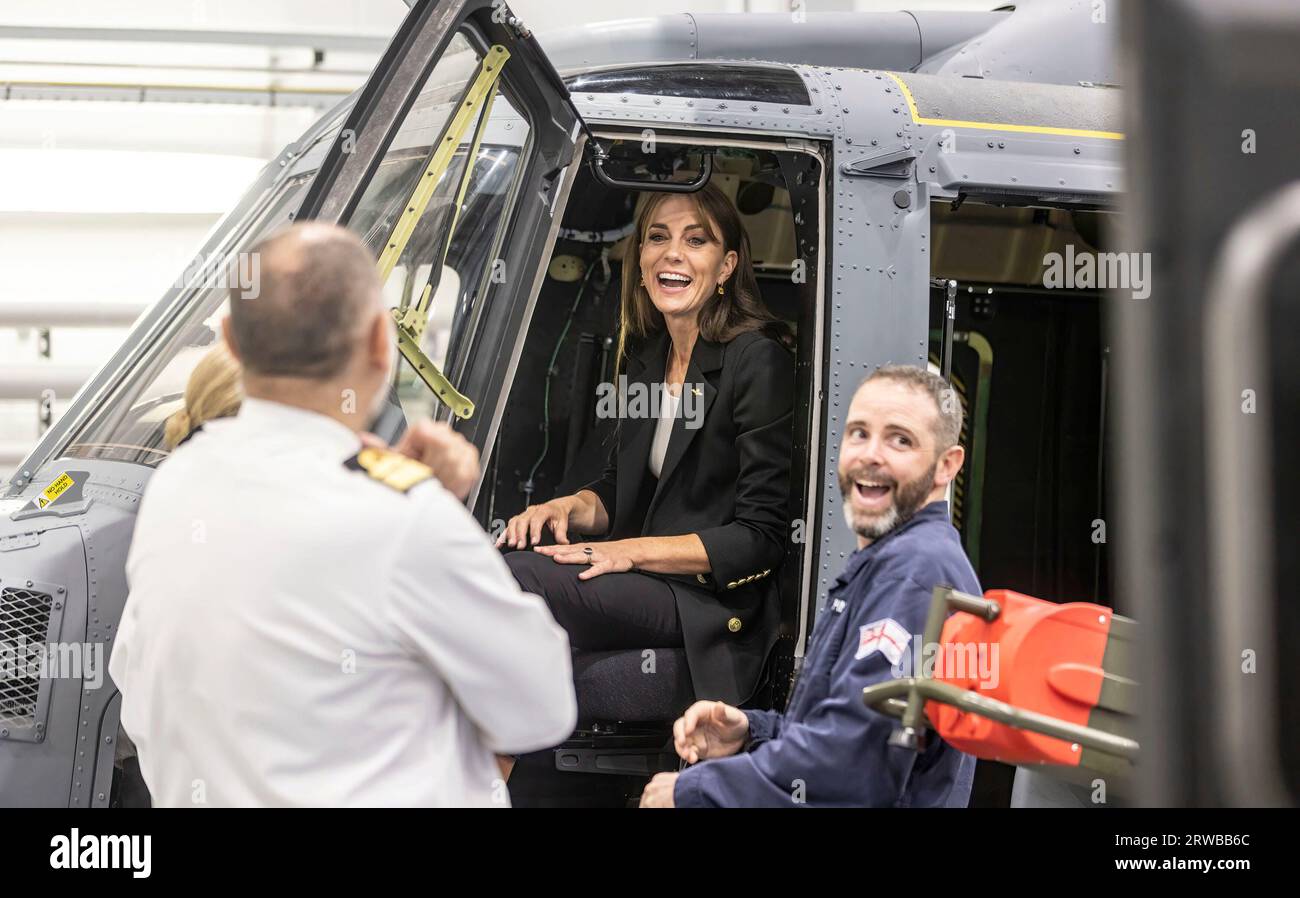 Britain’s Kate, Princess of Wales, center, smiles as she sits in a ...