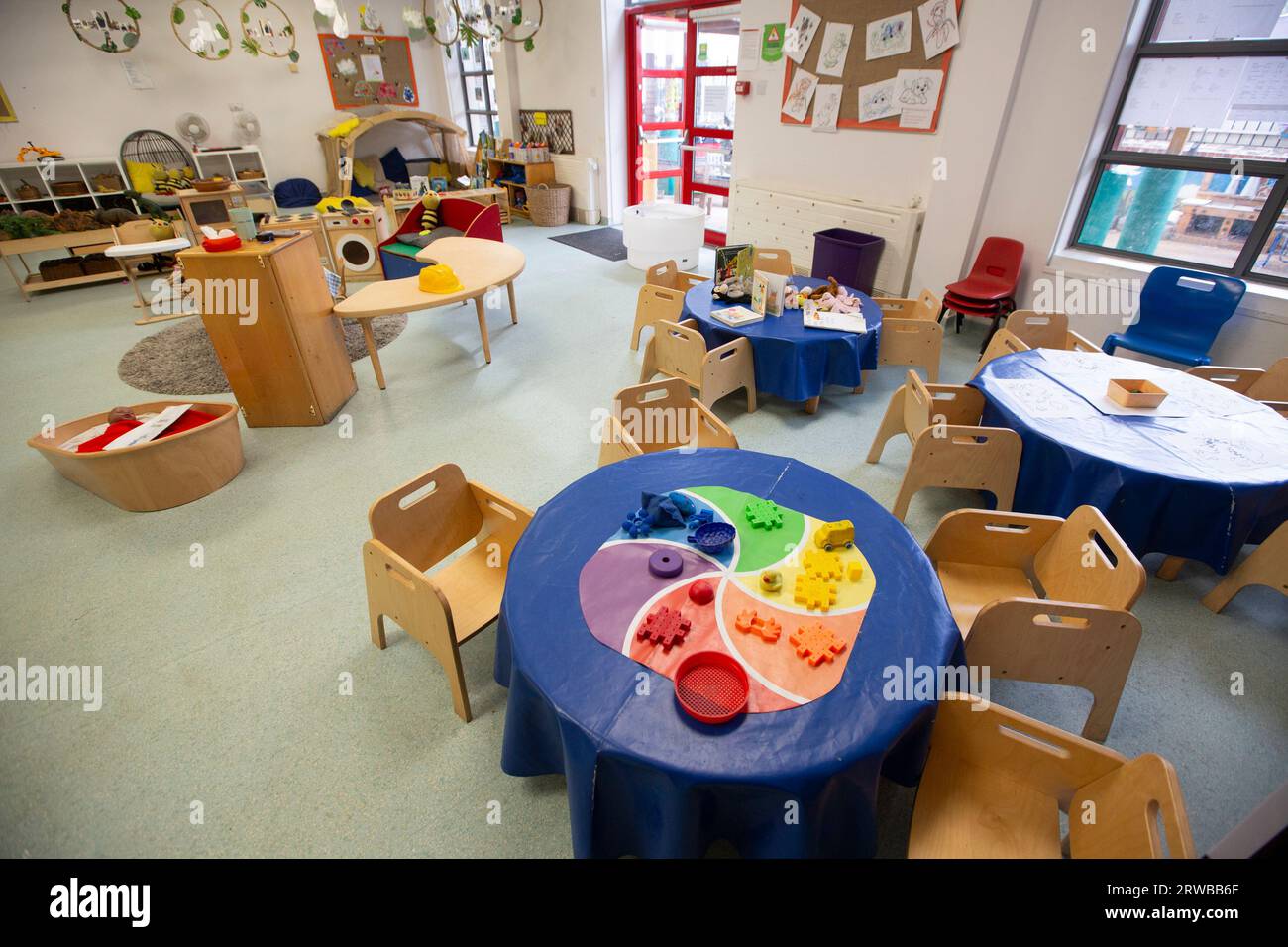 Nursery classroom scene for primary aged school children full of ...