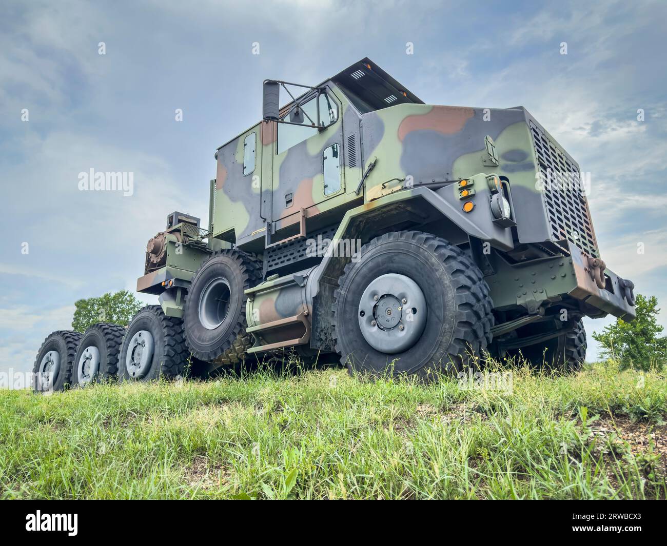 old, decommissioned military tractor truck with camo painting Stock ...