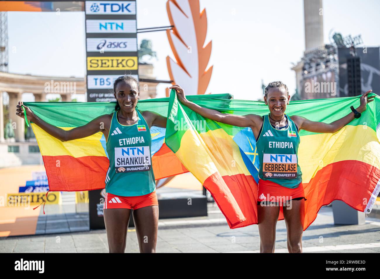 Amane Beriso SHANKULE and Gotytom GEBRESLASE with the medals and flags ...