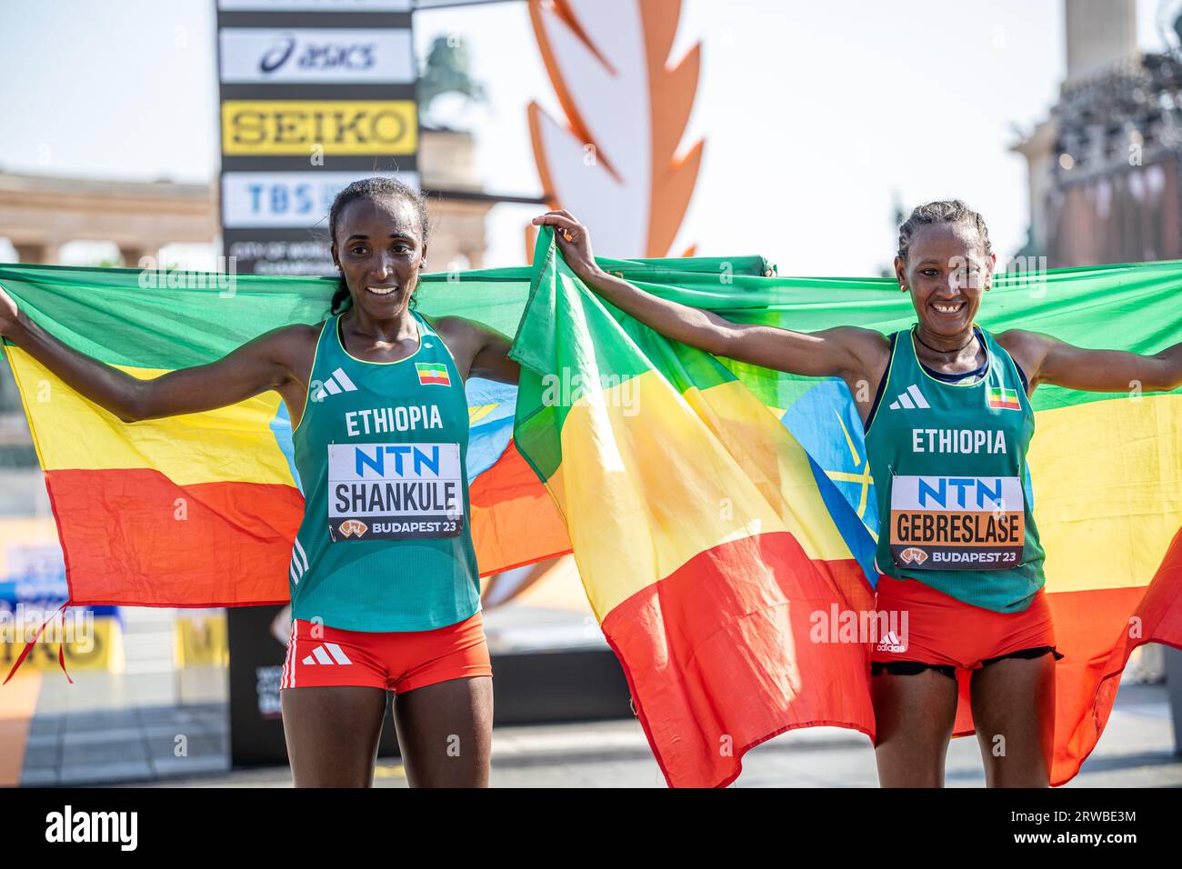 Amane Beriso SHANKULE and Gotytom GEBRESLASE with the medals and flags ...