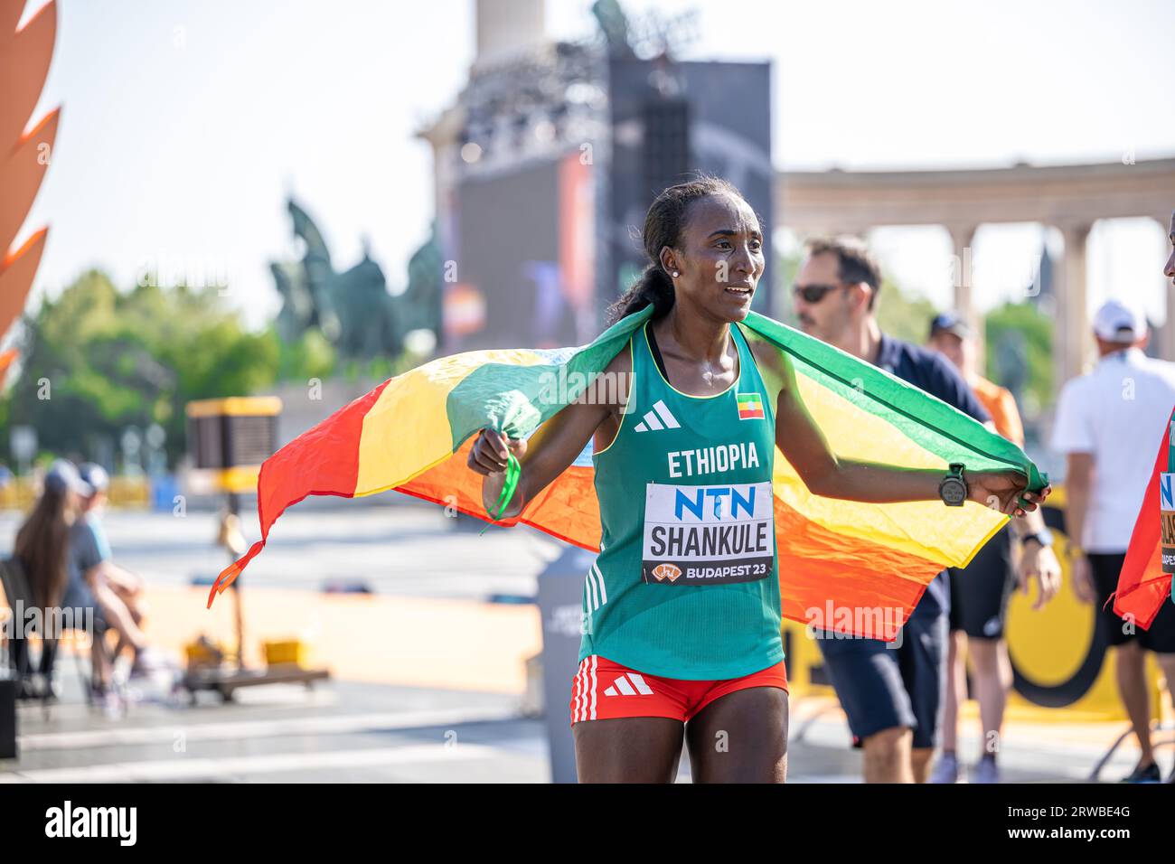 Amane Beriso SHANKULE with the medals and flags of their countries in ...