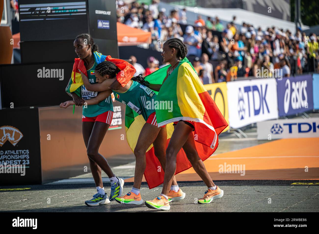 Amane Beriso SHANKULE and Gotytom GEBRESLASE with the medals and flags ...