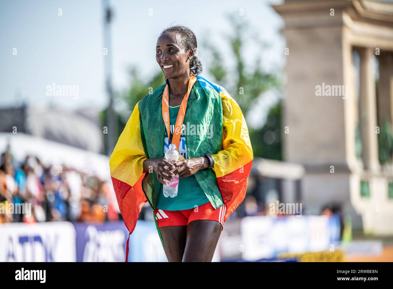 Amane Beriso SHANKULE with the medals and flags of their countries in ...