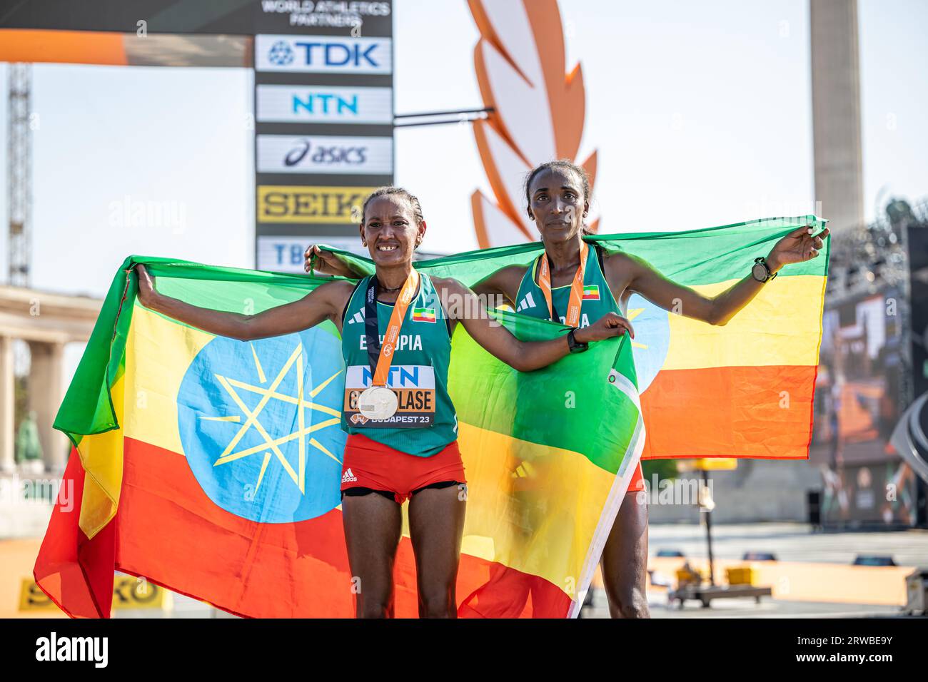 Amane Beriso SHANKULE and Gotytom GEBRESLASE with the medals and flags ...