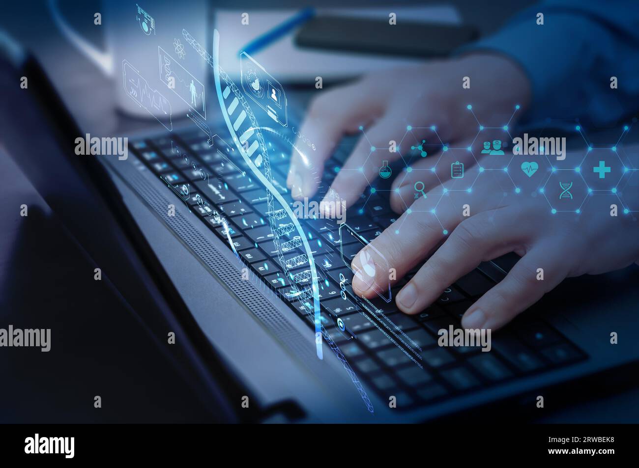 Close-up of a man's hands on a laptop keyboard and virtual screen with ...