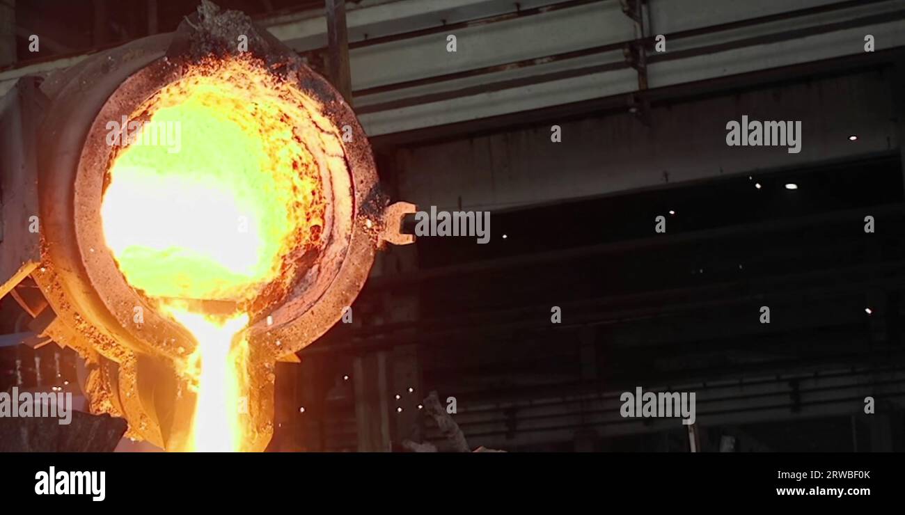 Metal cast process in blast furnace in metallurgical plant or factory ...
