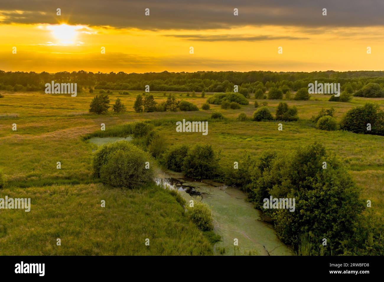 Aerial view of green grassland river valley of Westerstroom creek in ...