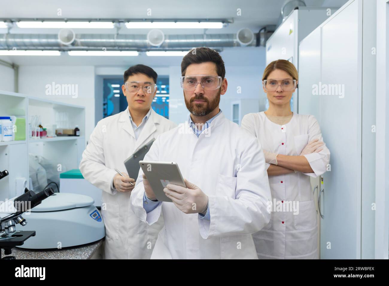 Confident team of scientists in the lab hi-res stock photography and ...