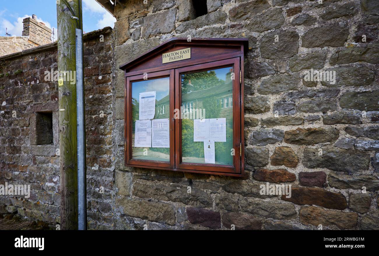 Parish notice board attached to a stone barn wall Stock Photo - Alamy