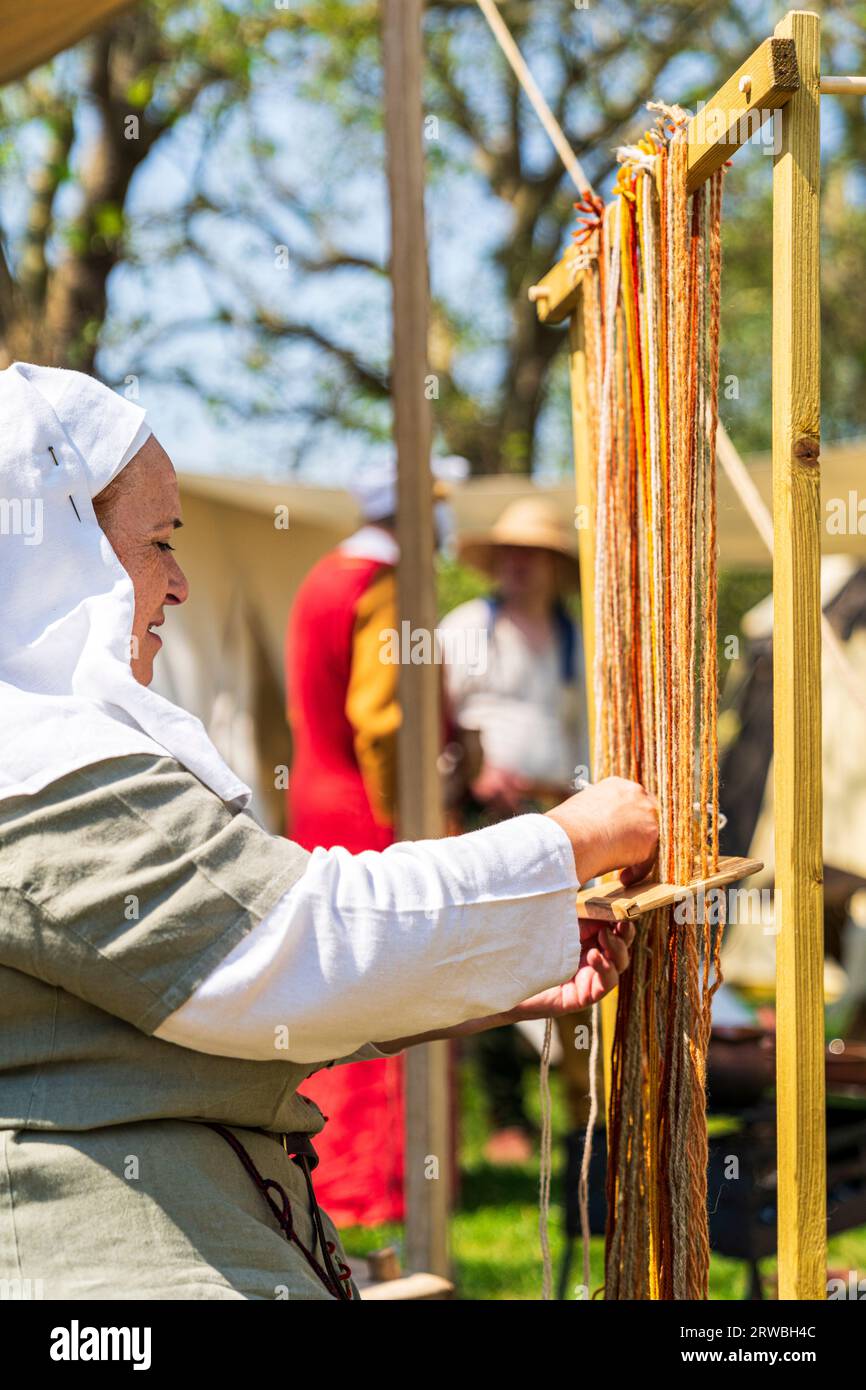 Medieval living history event. Close up of a middle aged lady in middle ...