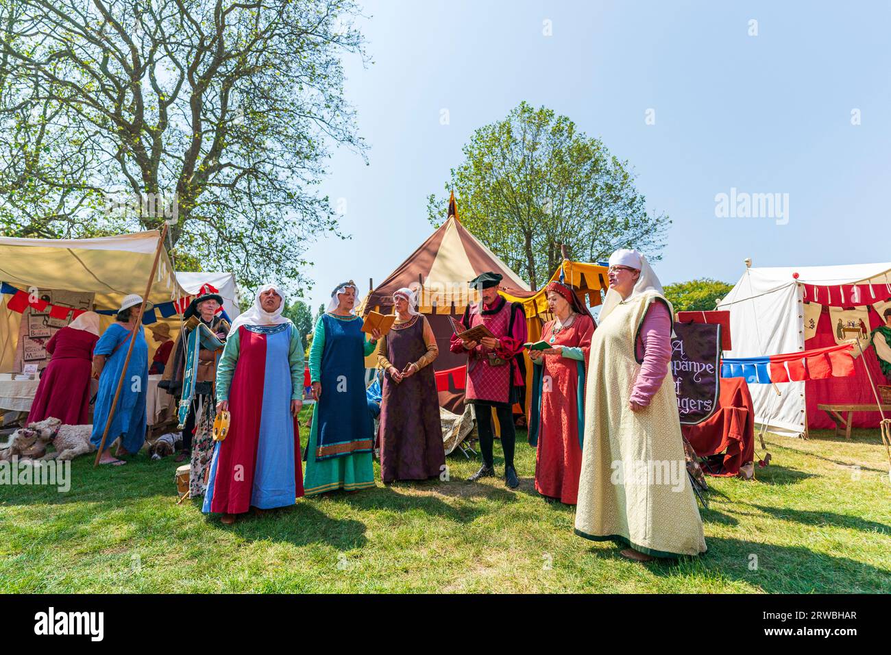 The Rough Musicke medieval group of troubadours standing singing in ...