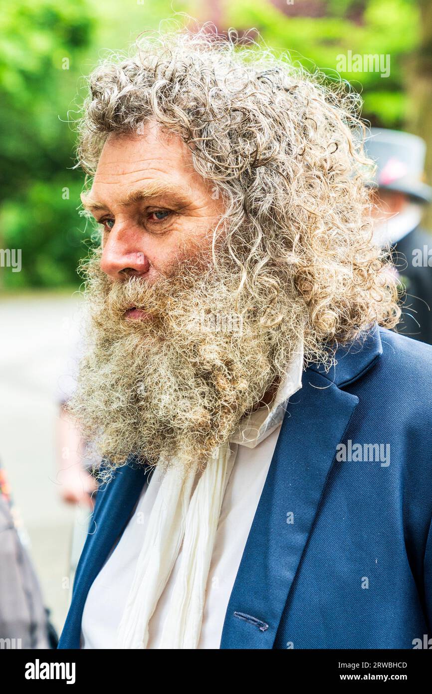 Side view head shot of senior man's face with very bushy beard and ...