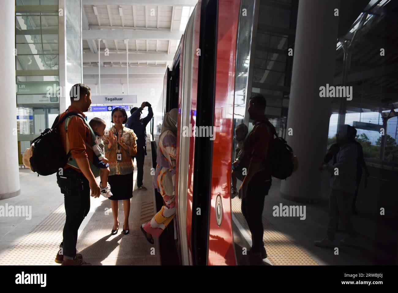 Indonesian passengers enter Tegalluar train station to ride on the ...