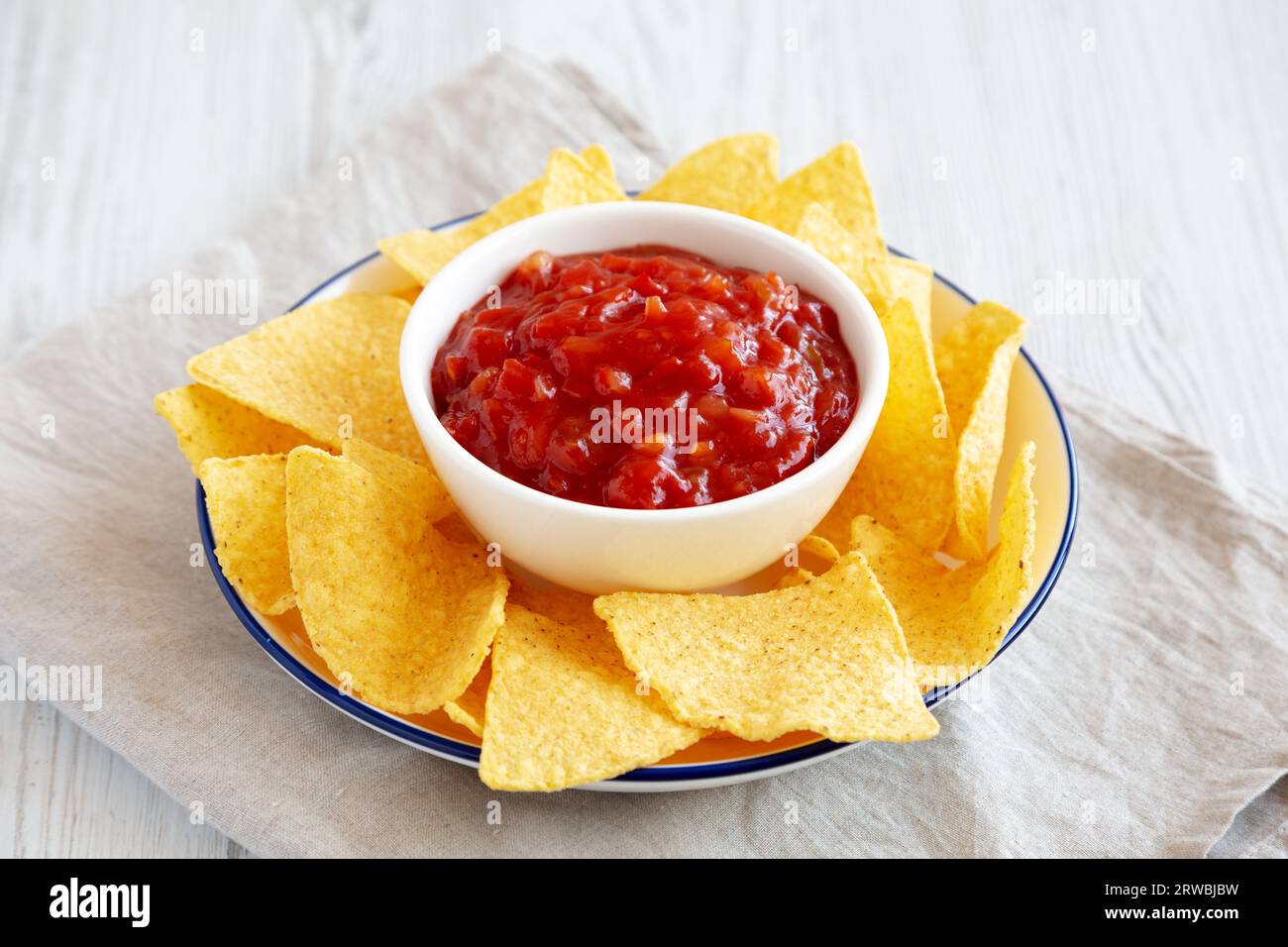 Homemade Salsa and Tortilla Chips on a Plate, side view Stock Photo - Alamy