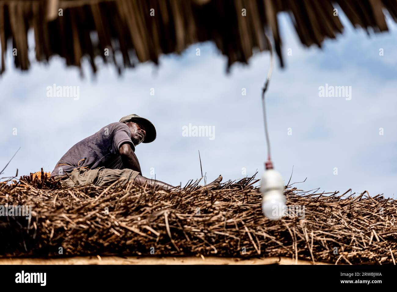 Dar es Salaam, Tanzania - March 2022: The local man is repairing a ...