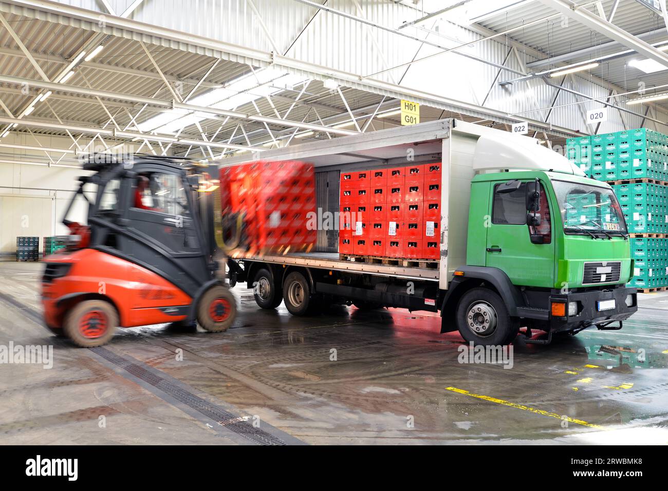 loading of beer crates for trade in a brewery - forklift trucks and ...