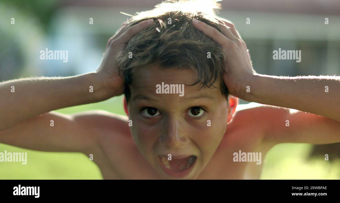 Kid reacting with horror and SHOCK by yelling and screaming to camera ...