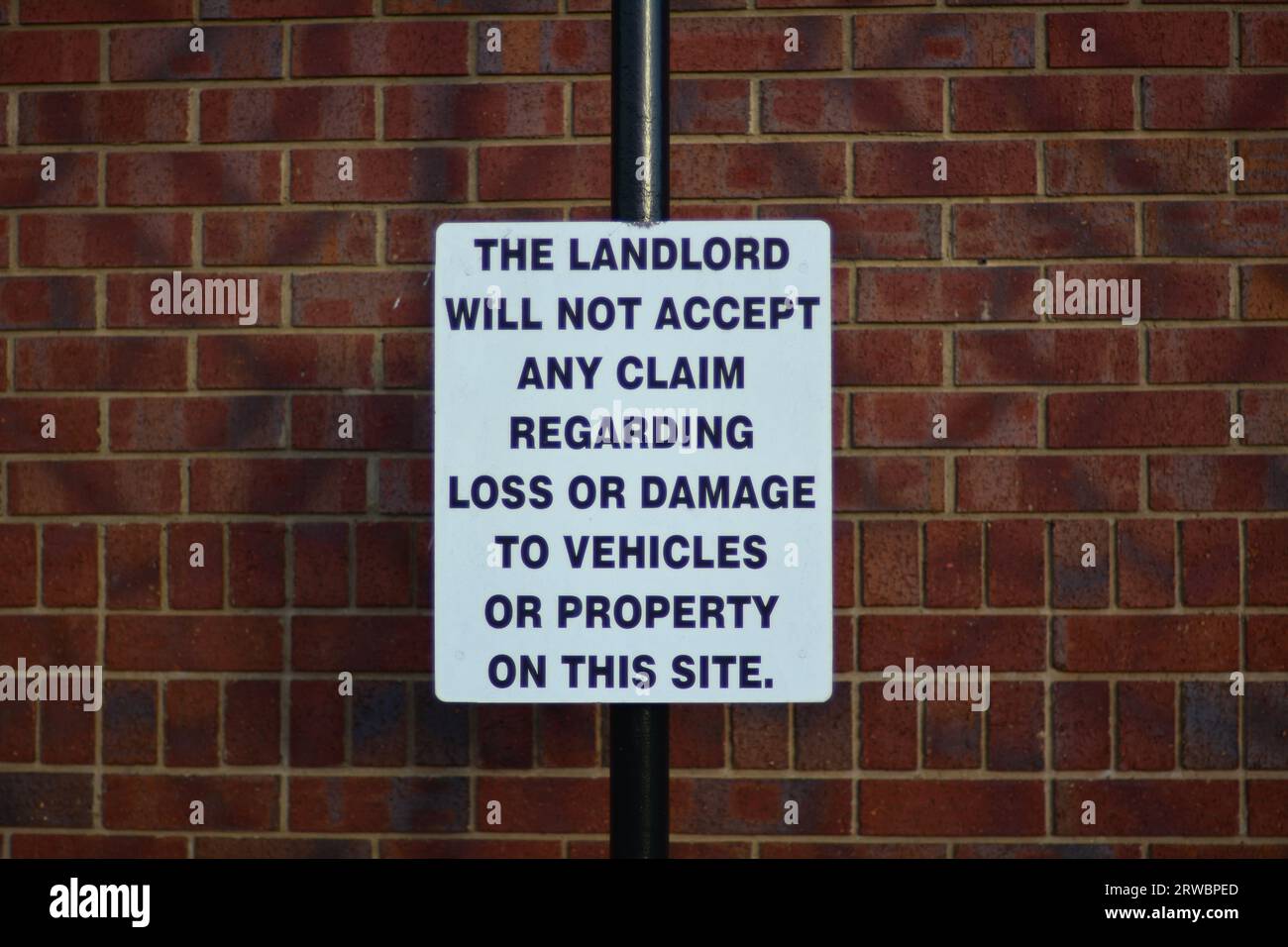 Car parks No responsibility landlord signs Stock Photo - Alamy