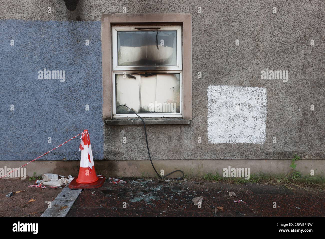 Broken window from an arson attack on a south Belfast grocery store ...
