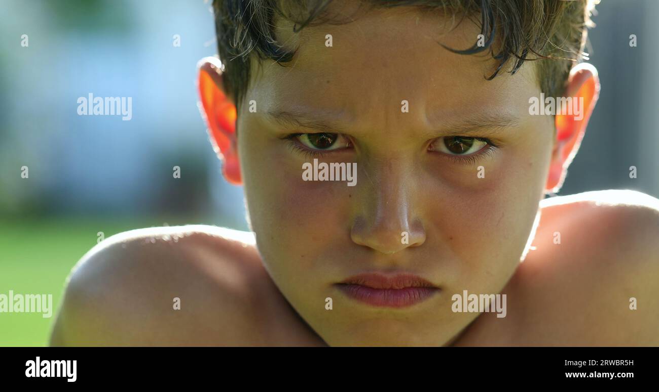 Handsome young boy child face smiling feeling happy and joy in outdoor ...