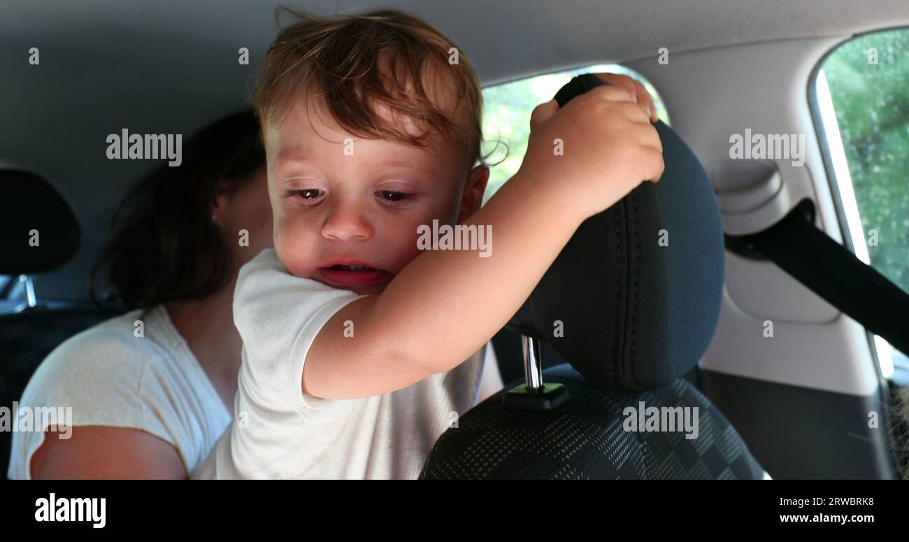 Mother holding baby infant in backseat car without security prevention ...