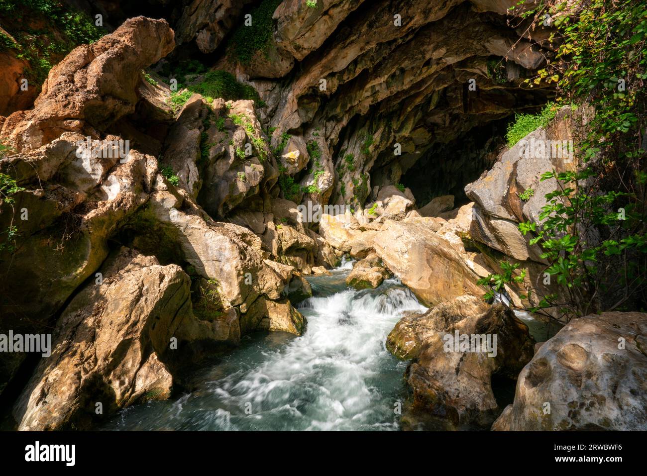 From above transparent clear rippling river water flowing through rocky ...