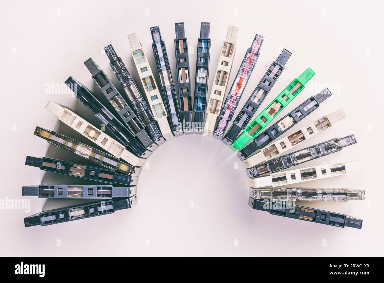 old cassettes arranged in an arc on a white background Stock Photo - Alamy