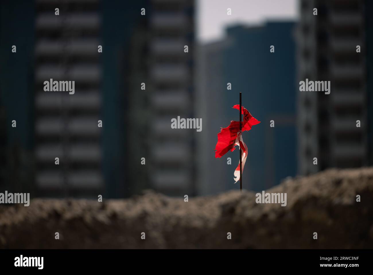 Metal survey peg with red flag on construction site. foundation laying ...