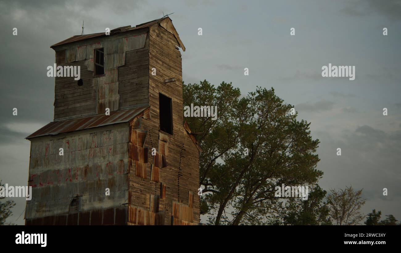 Old abandoned grain mill in an early spring pastoral setting at magic ...
