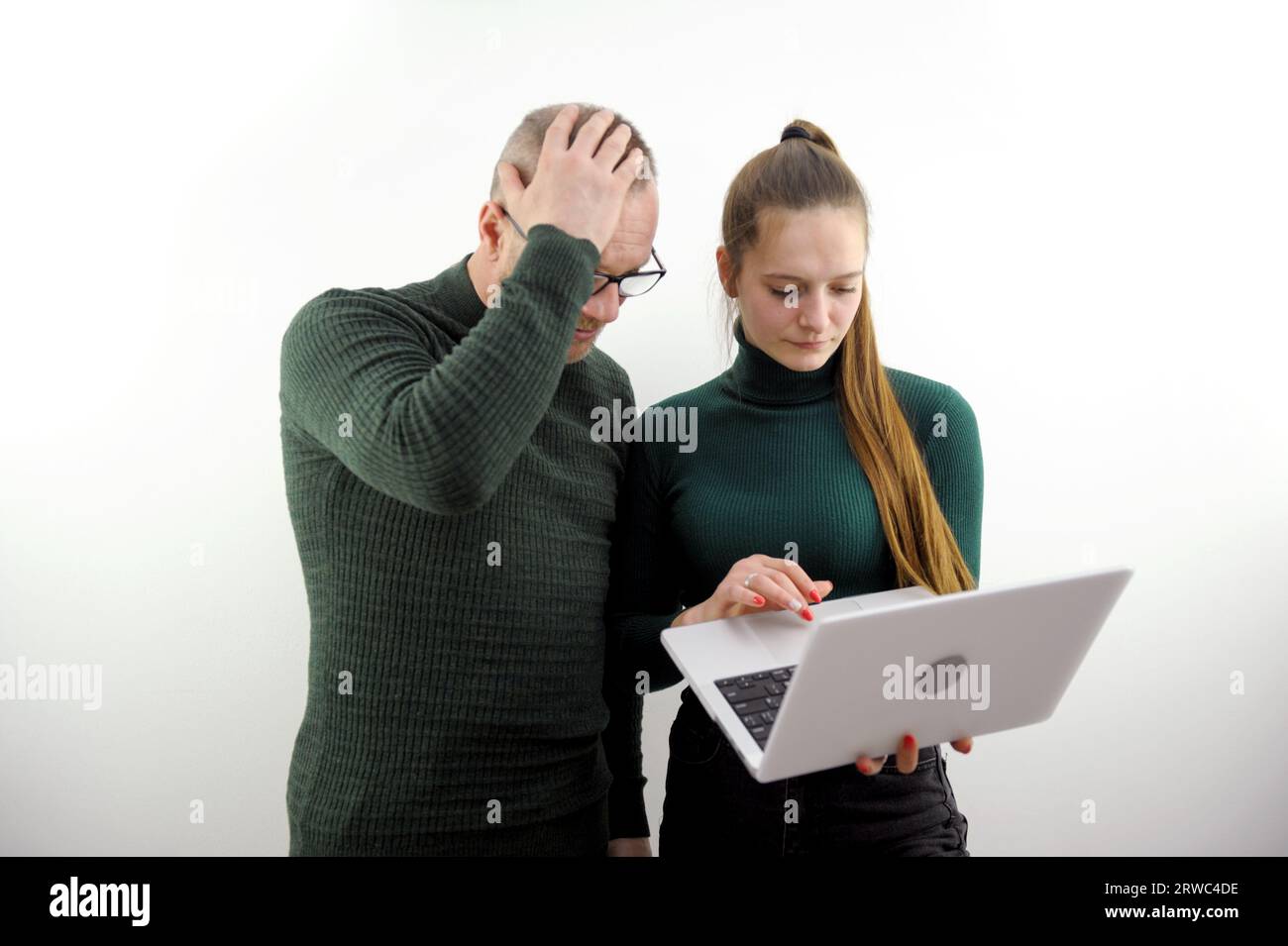 error in work man adult in horror clutching his head young girl calmly ...