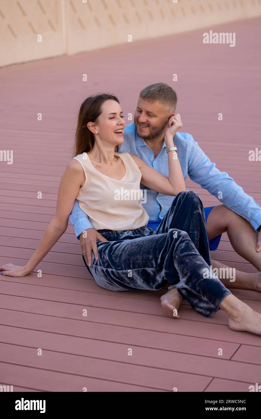 romantic couple resting by the sea Stock Photo - Alamy