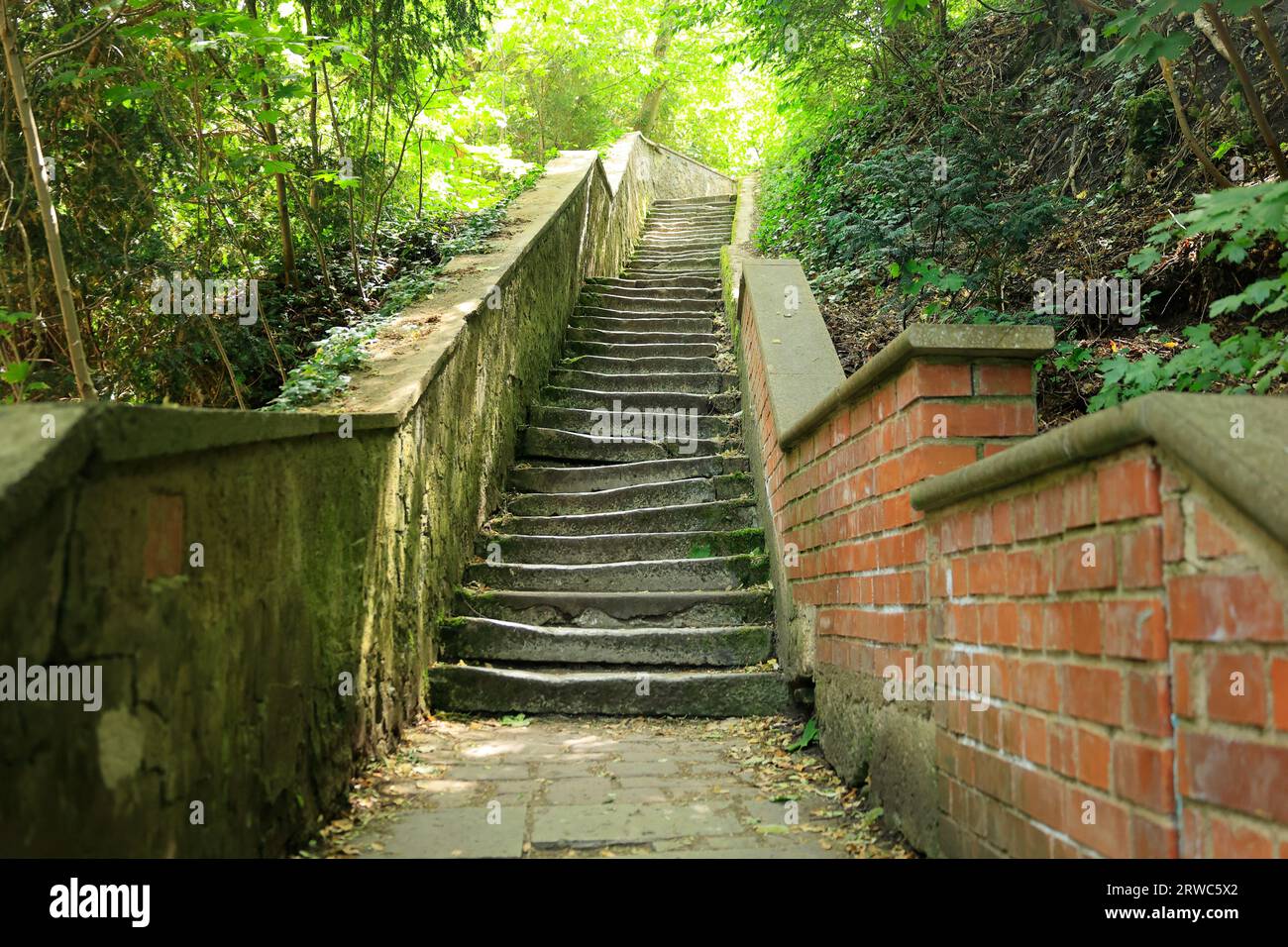 Staircase with crooked steps leads upwards into brightness Stock Photo ...