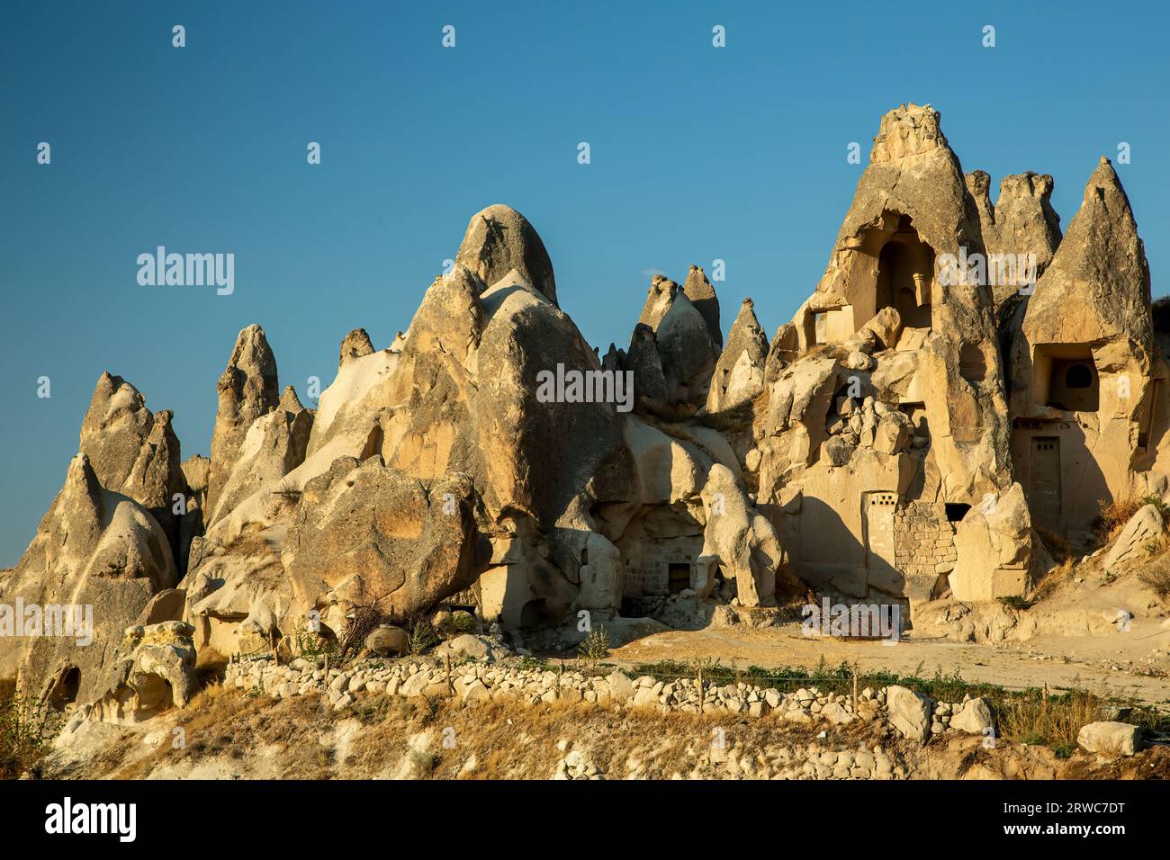 Dwellings built inside fairy chimneys, Swords Valley (Meskendir), near ...